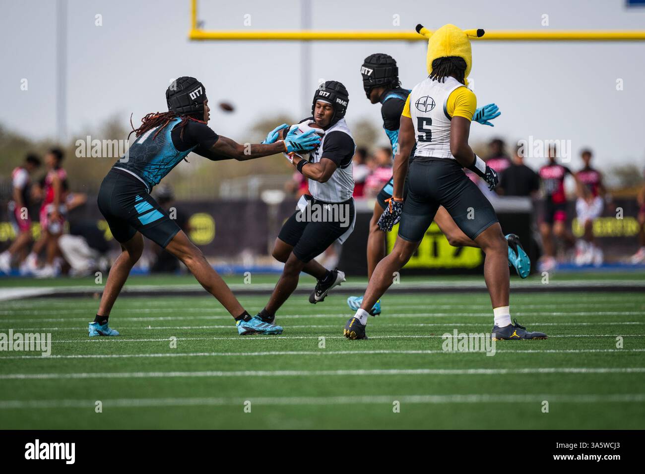 Coastline Stars' Miguel Whitley protects the football from Miami Raw's ...