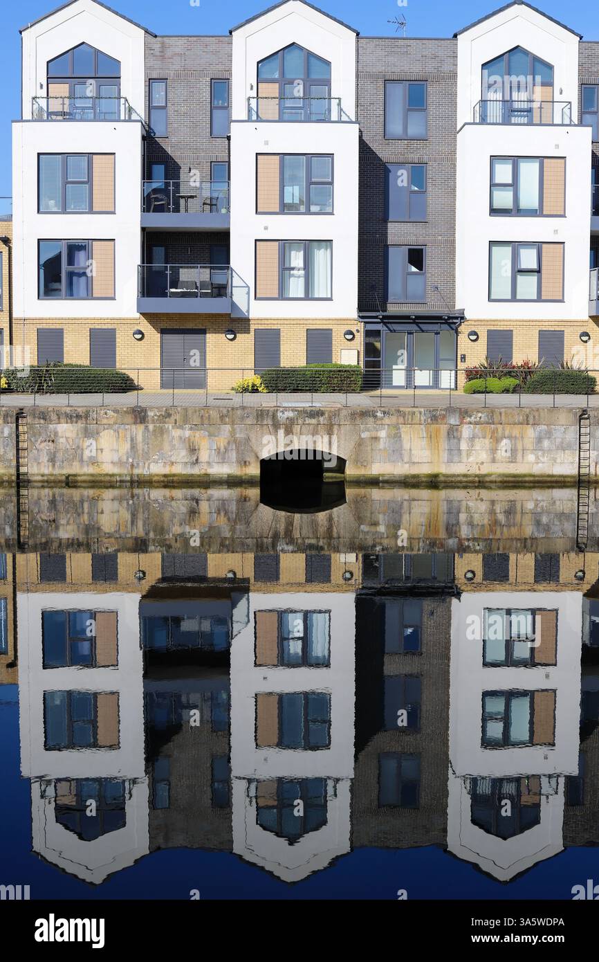 Modern waterside properties and apartments surrounding marina at ...