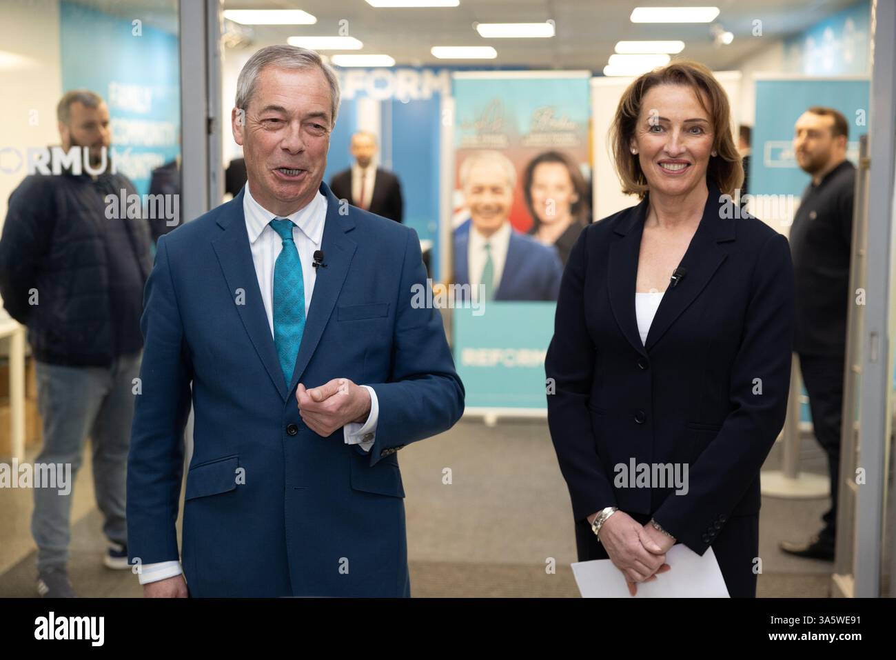 Reform UK leader Nigel Farage stands with Sarah Pochin after announcing ...
