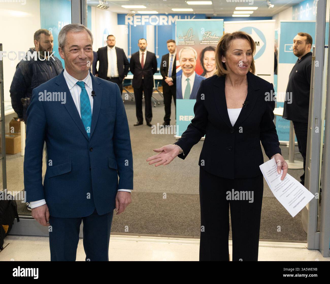 Reform UK leader Nigel Farage stands with Sarah Pochin after announcing ...