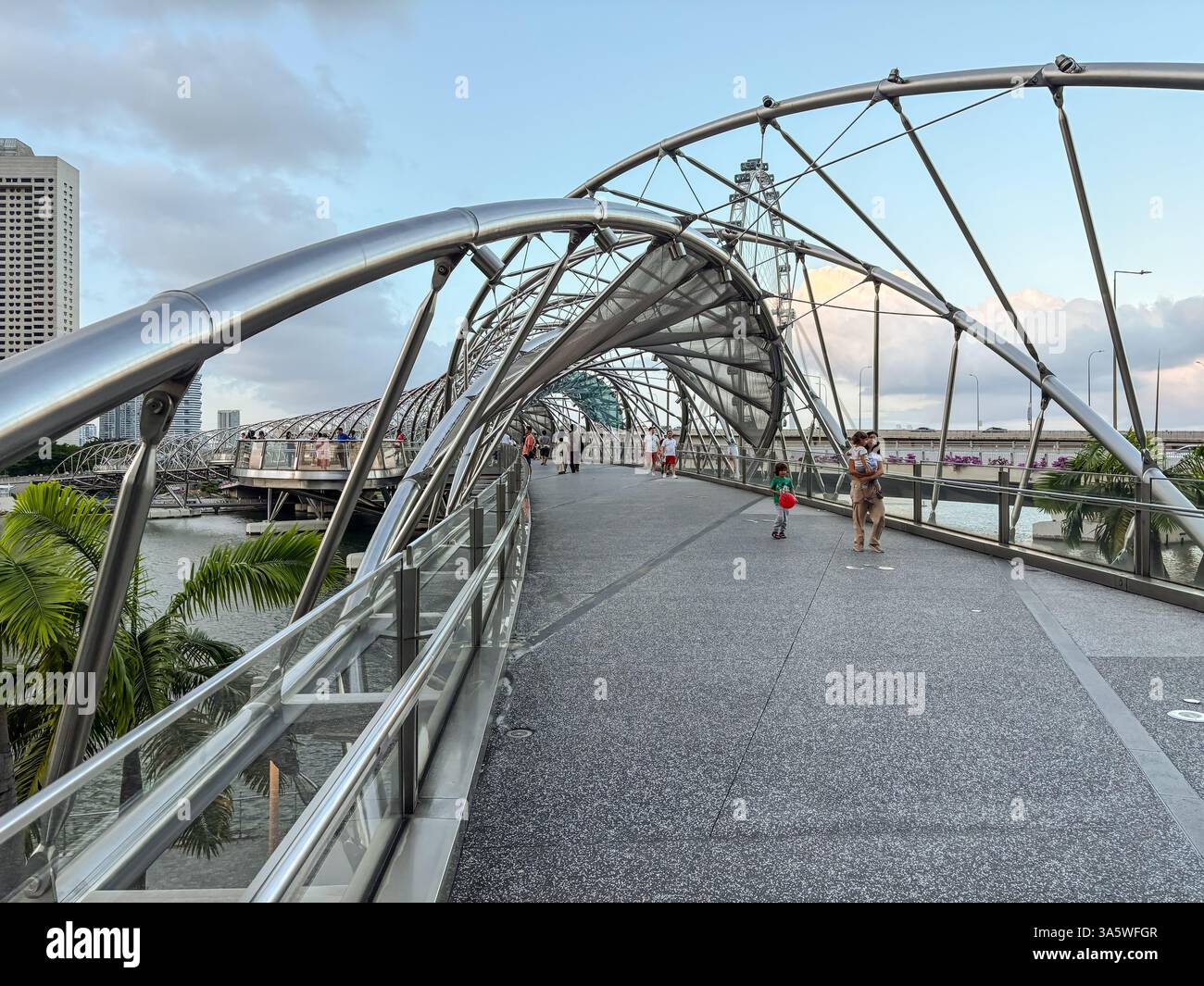 The Helix bridge in Singapore, a pedestrian bridge linking Marina Bay ...