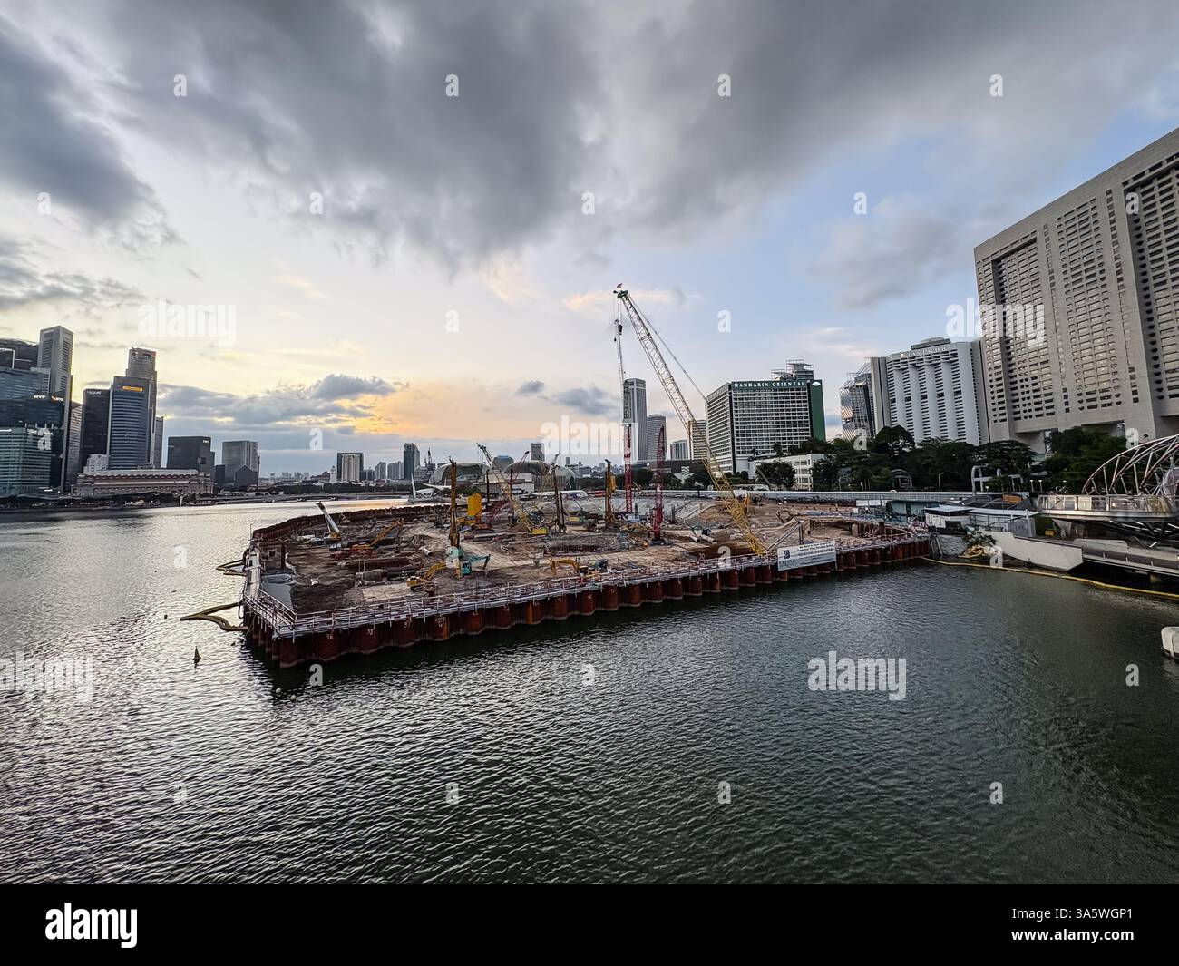 A construction site on a platform surrounded by water in Singapore ...