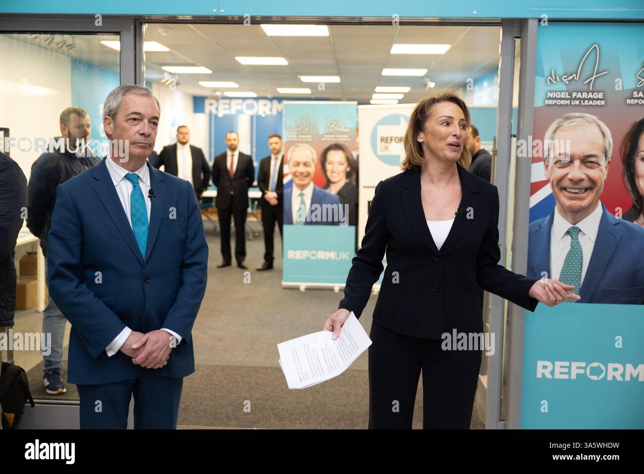 Reform UK leader Nigel Farage stands with Sarah Pochin after announcing ...