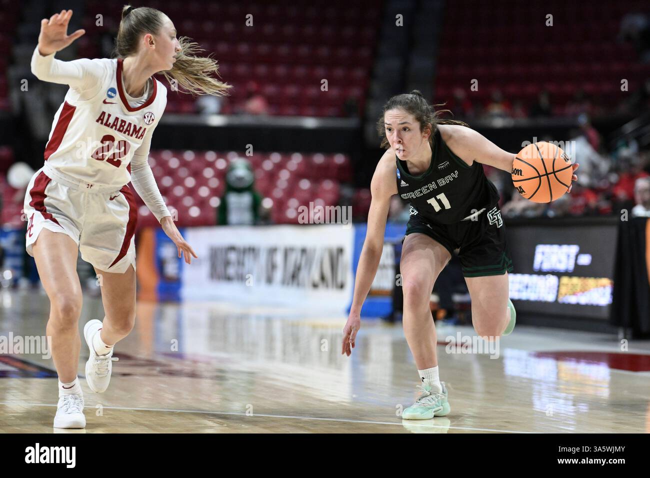 Green Bay guard Natalie McNeal (11) drives to the basket as Alabama ...