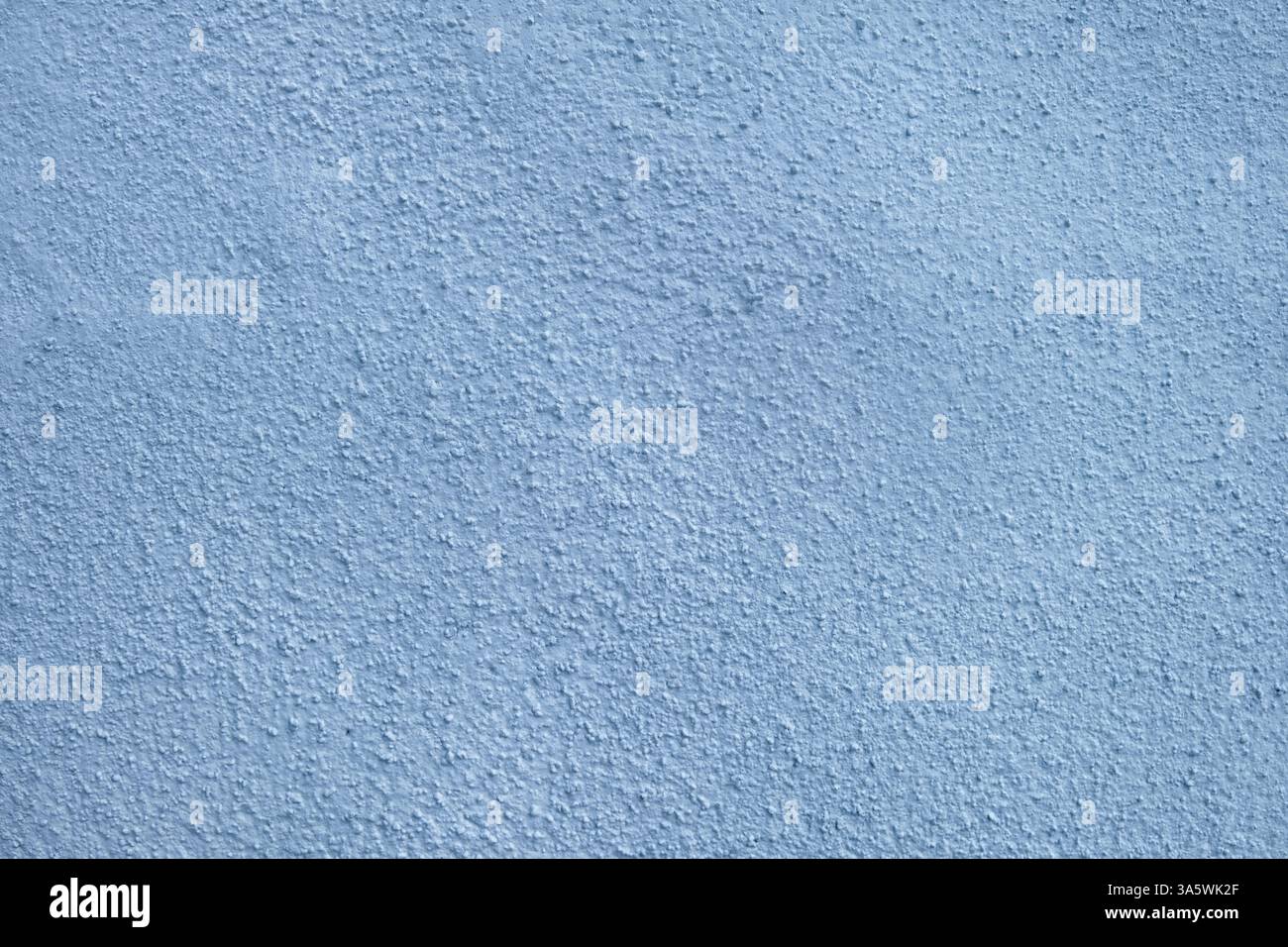 Blue stucco wall texture with small bumps, rough plaster surface. Warm ...