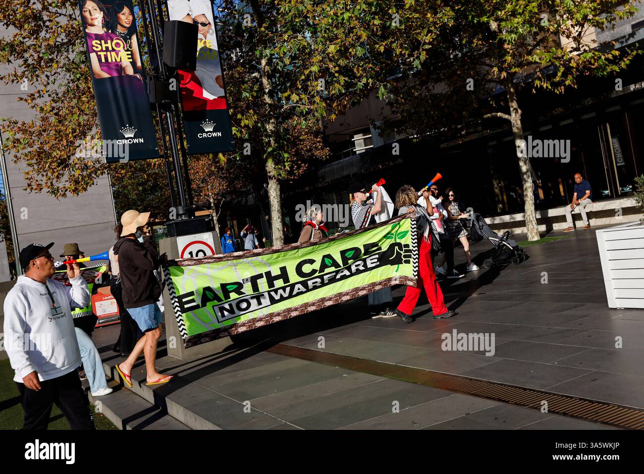 Demonstrators seen holding banners and chanting during a protest ...