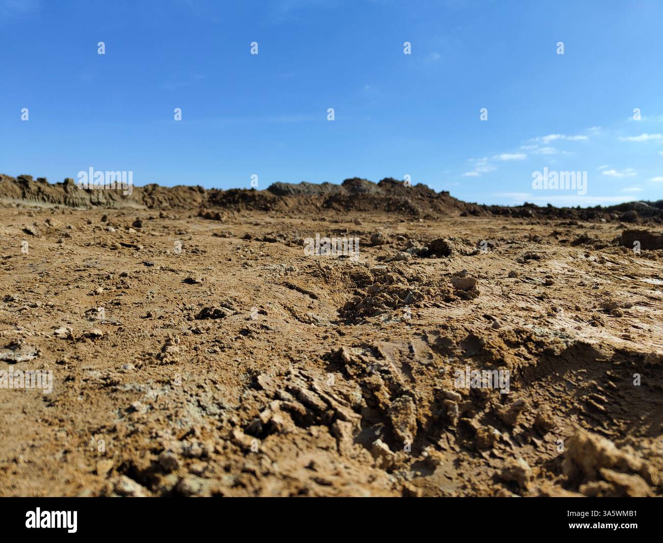 Dry desert landscape under clear blue sky in remote terrain Stock Photo ...