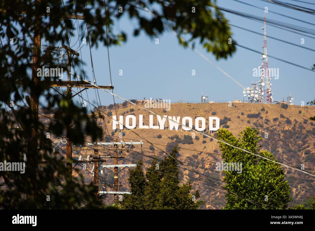 The famous Hollywood sign on Mount Lee, Los Angeles, with the Central Communications facility ...