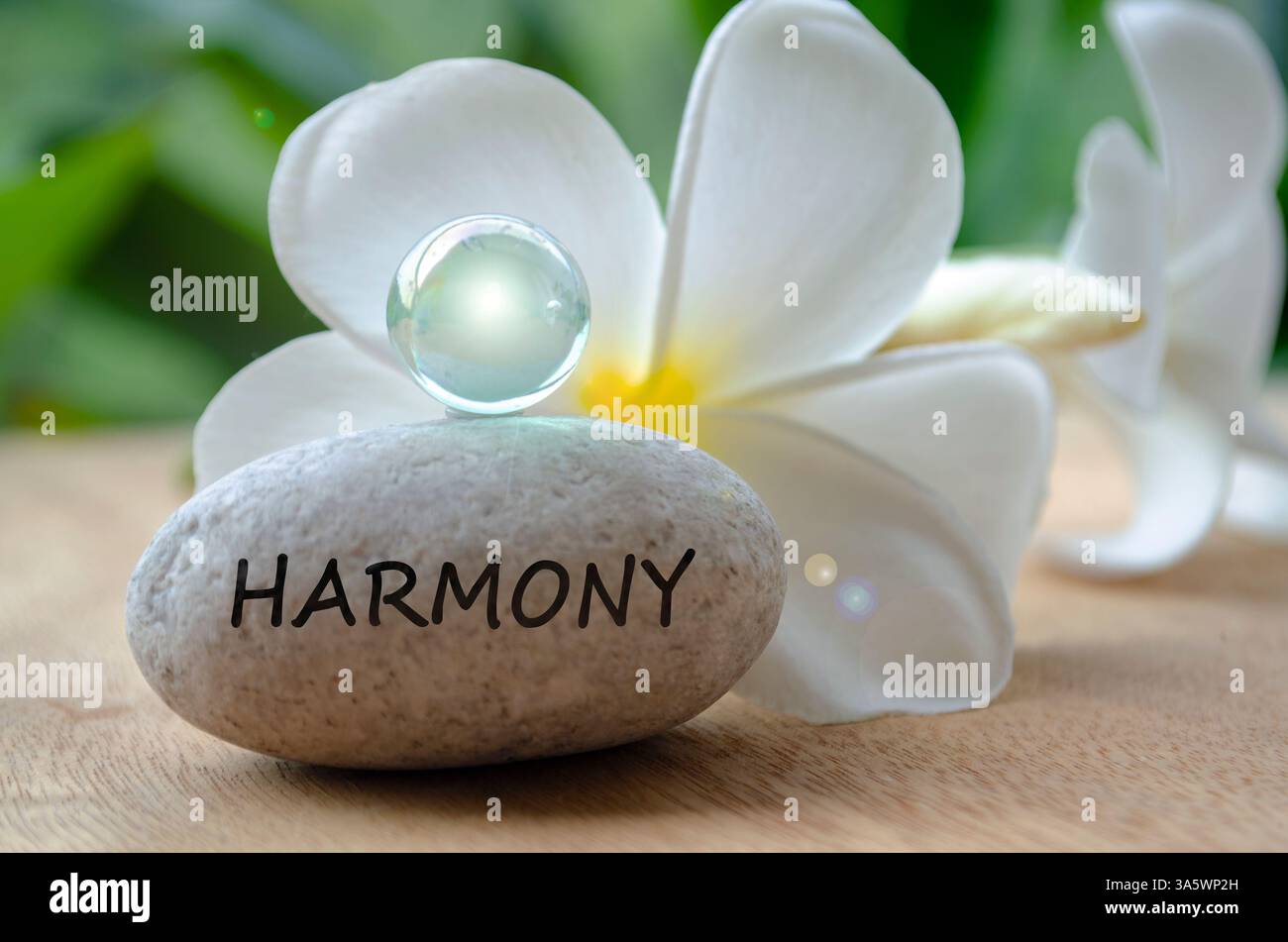 Harmony text on stone with shining marbles. Peace and harmony concept ...