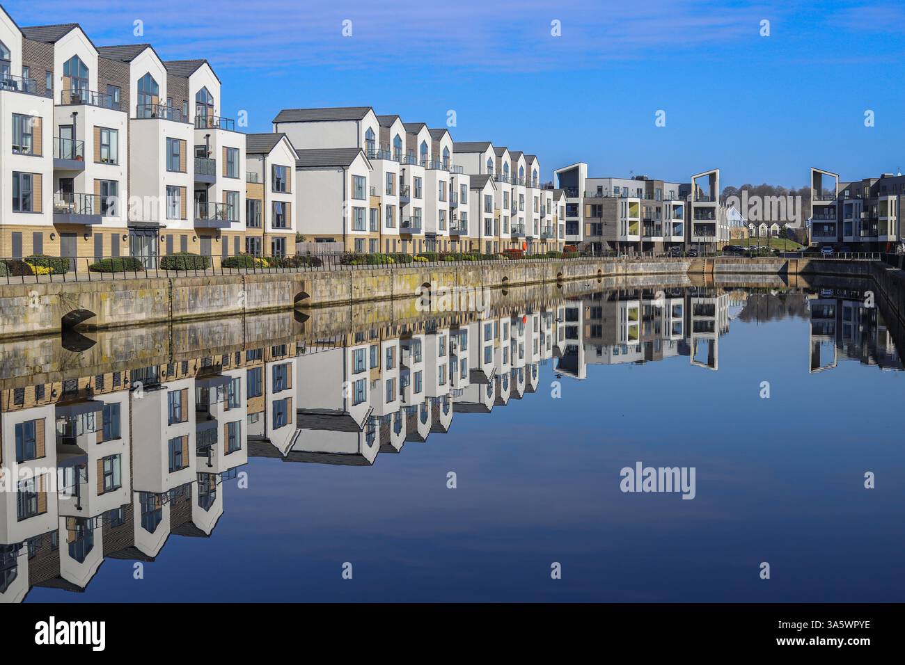 Modern waterside properties and apartments surrounding marina at ...