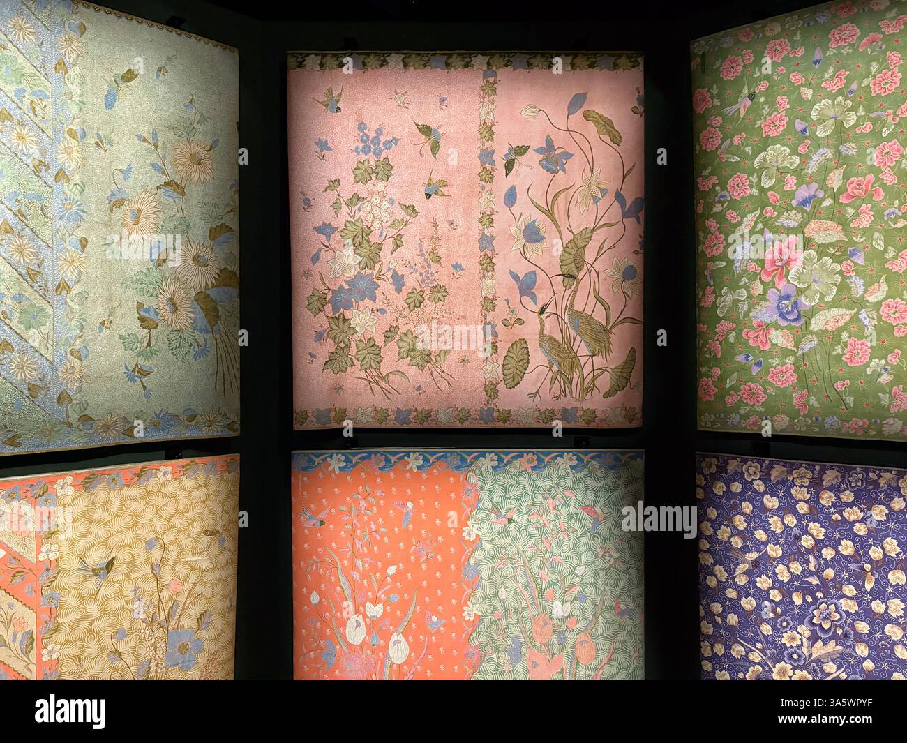 Displays of colourful batik textiles with intricate patterns in ...