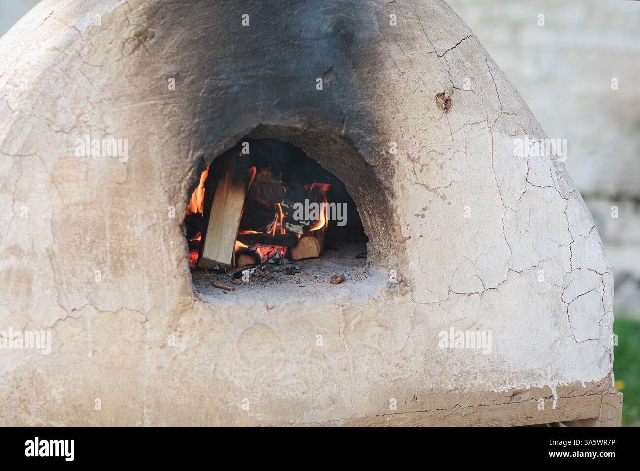 Rustic Wood-Fired Oven Burning Brightly Outdoors Stock Photo - Alamy
