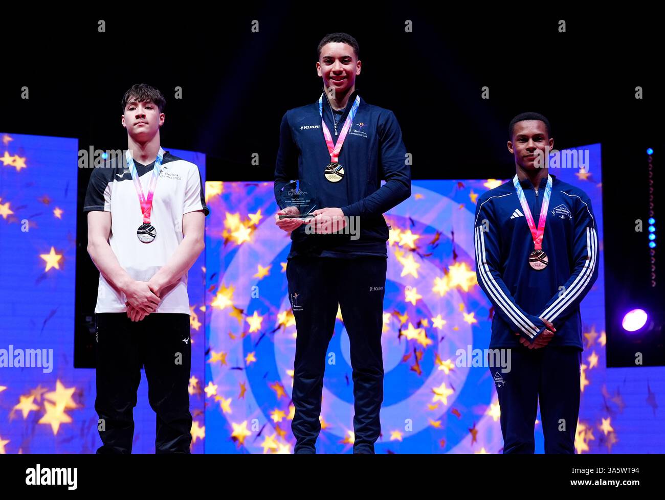 (left to right) Kieran Rockett with the silver medal, Sol Scott with ...