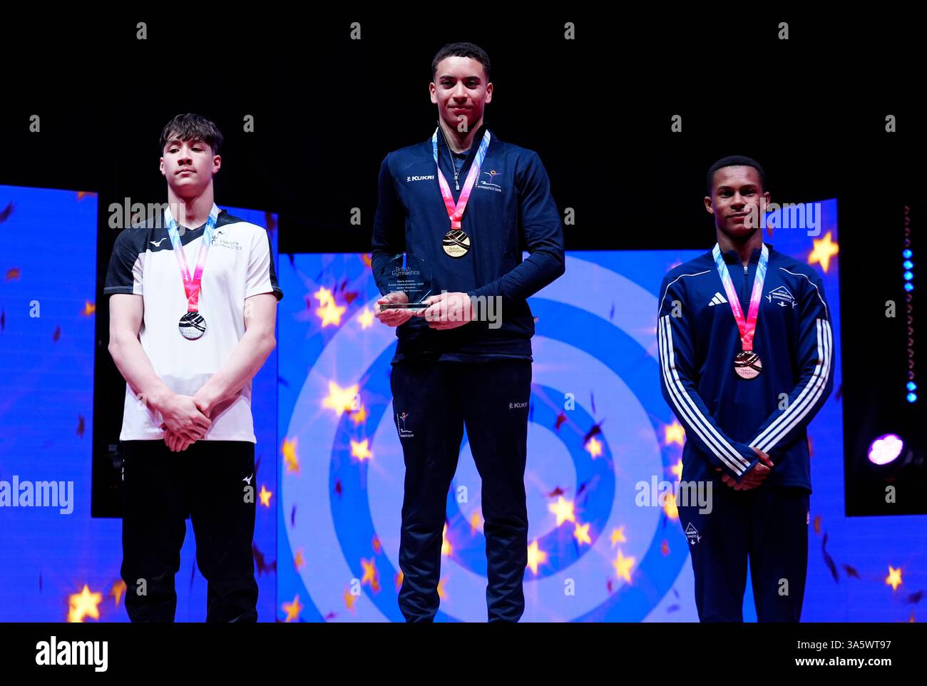 (left to right) Kieran Rockett with the silver medal, Sol Scott with ...