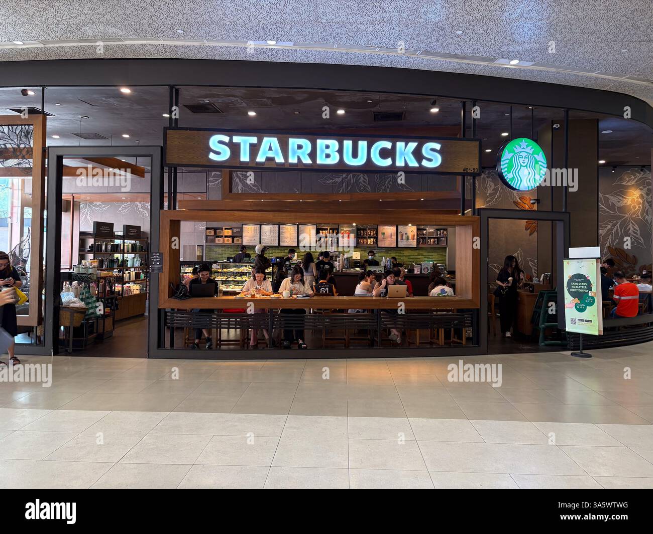 Starbucks Cafe in Singapore with customers inside the store. Starbucks ...