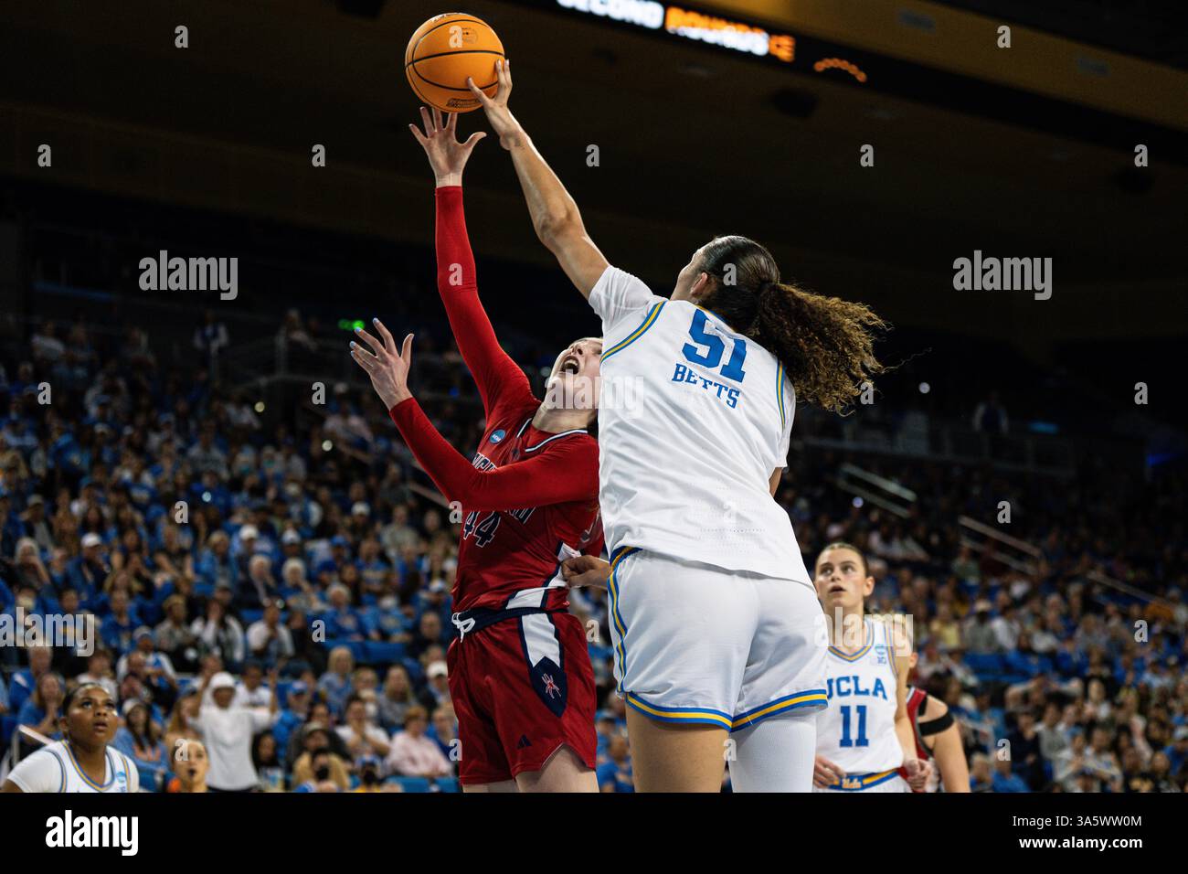 UCLA Bruins center Lauren Betts (51) blocks a shot by Richmond Spiders ...