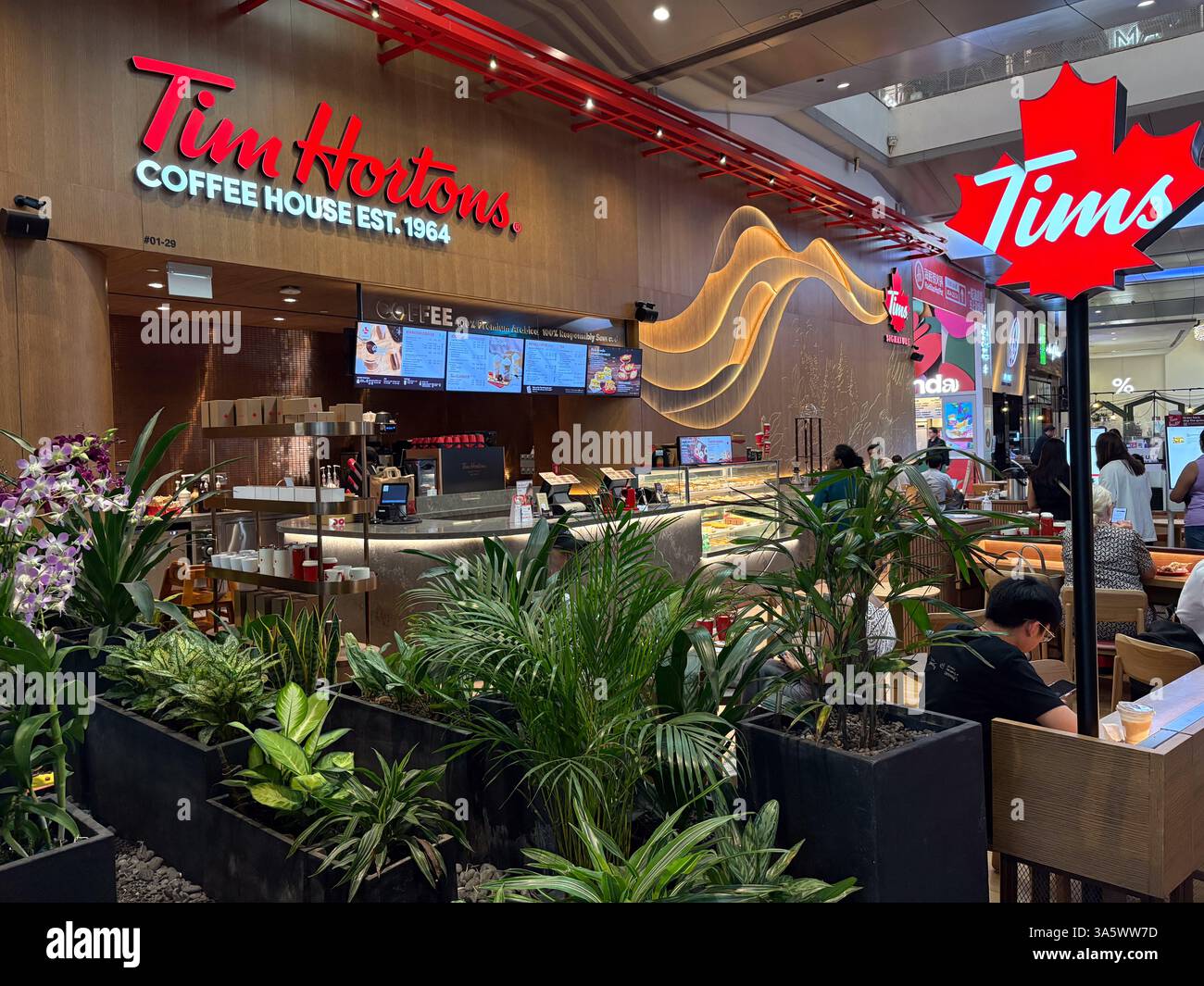 Tim Hortons coffee shop in Singapore, with people sitting at tables ...