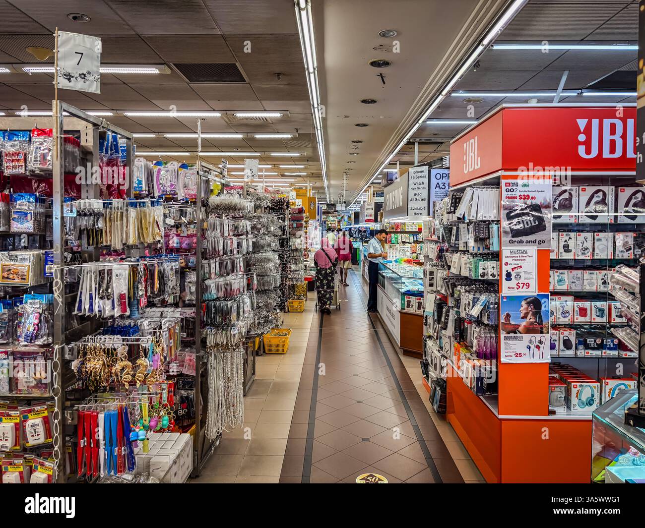 An interior view of a busy aisle at the Mustafa Centre in Singapore ...