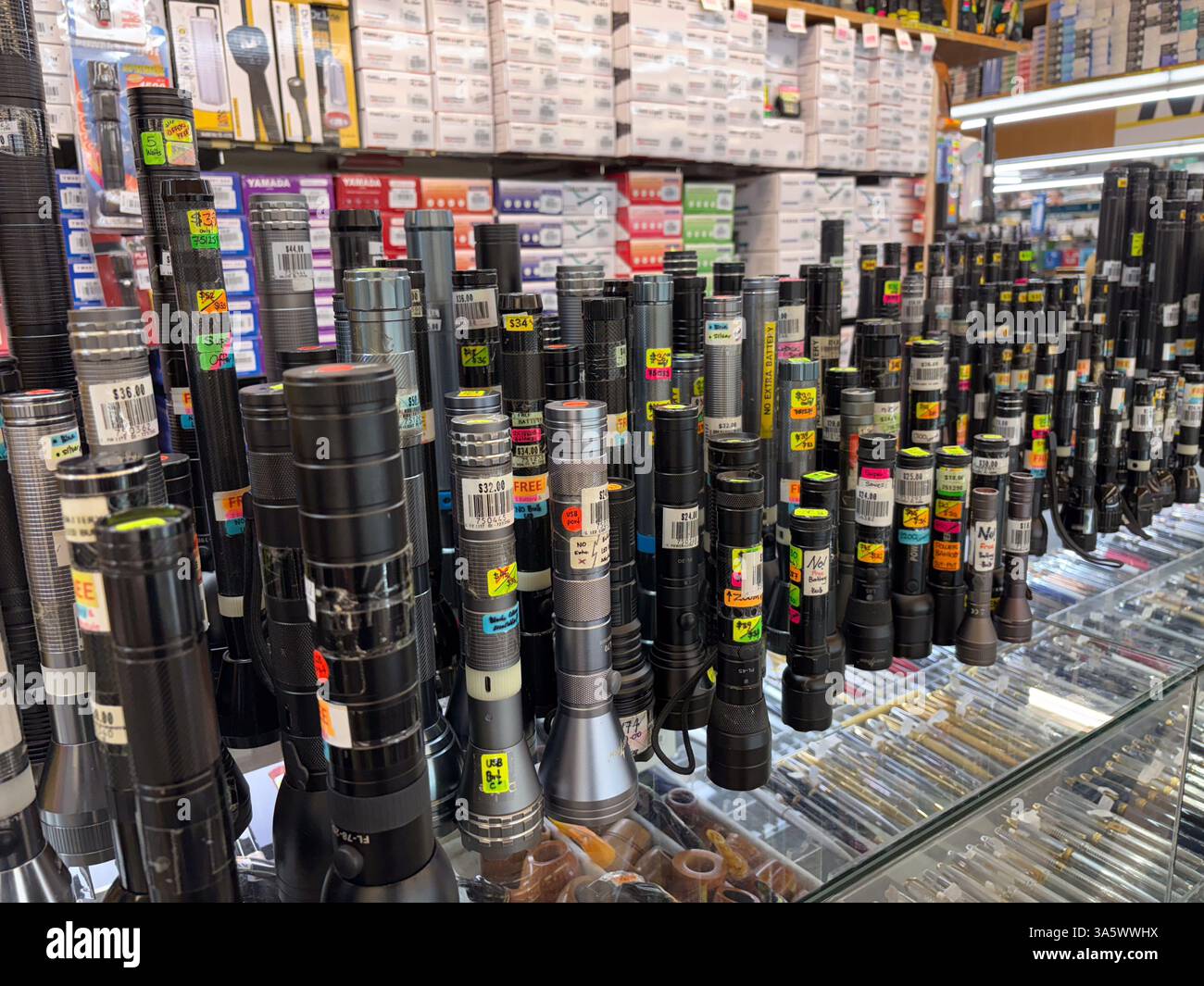 Display of flashlights for sale in Mustafa Centre, Singapore. The image ...