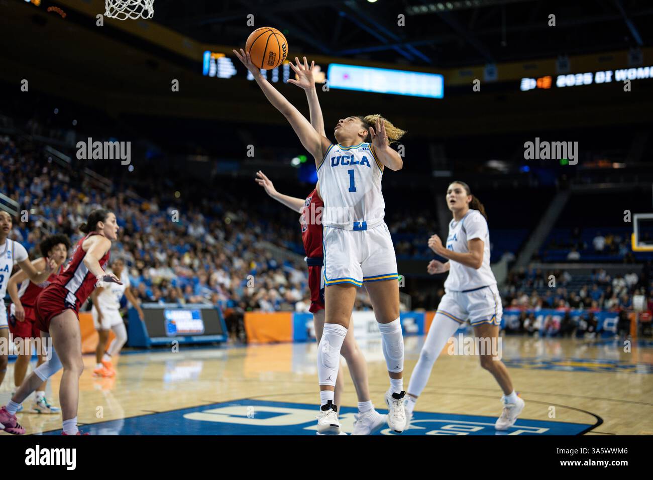 UCLA Bruins guard Kiki Rice (1) scores against Richmond Spiders forward ...
