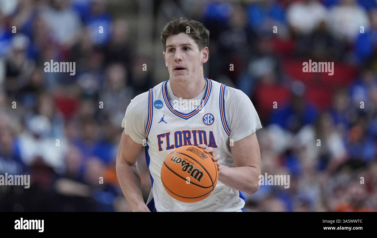 Florida forward Alex Condon brings the ball down court against UConn ...