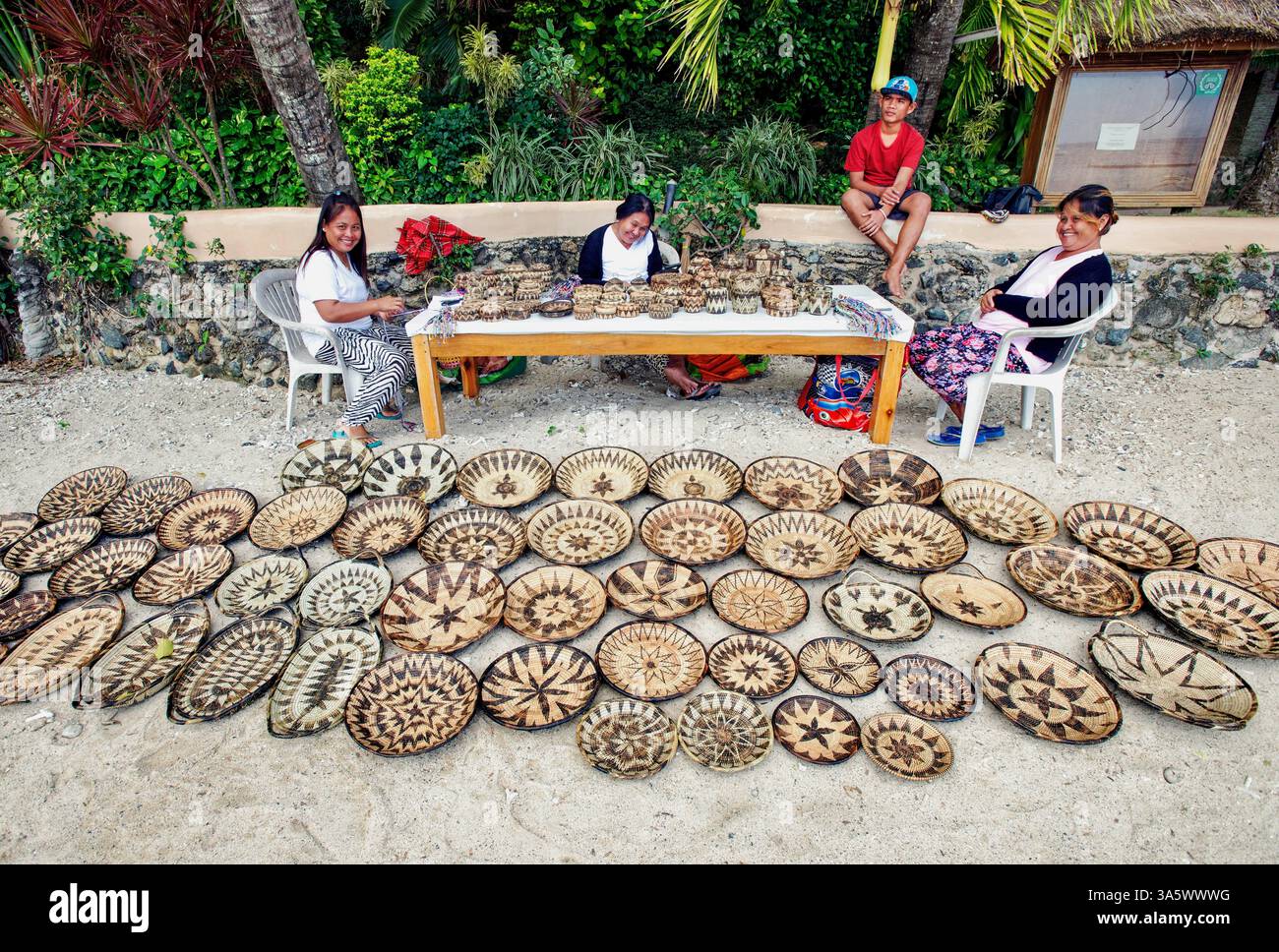Lea Delos Reyas sells local crafts such as weaved baskets made by the ...