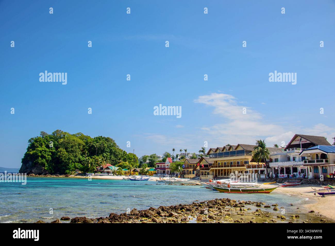 Photo shows the pretty cove at Big La Laguna, Puerto Galera, Mindoro ...