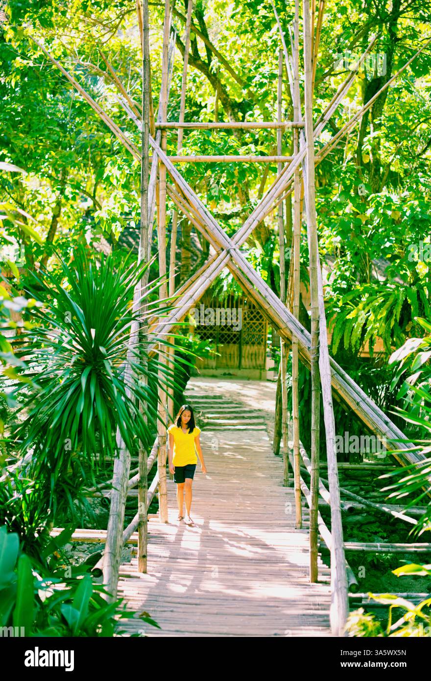 A member of the Iriya tribe, Mindoro’s indigenous people, walks across ...