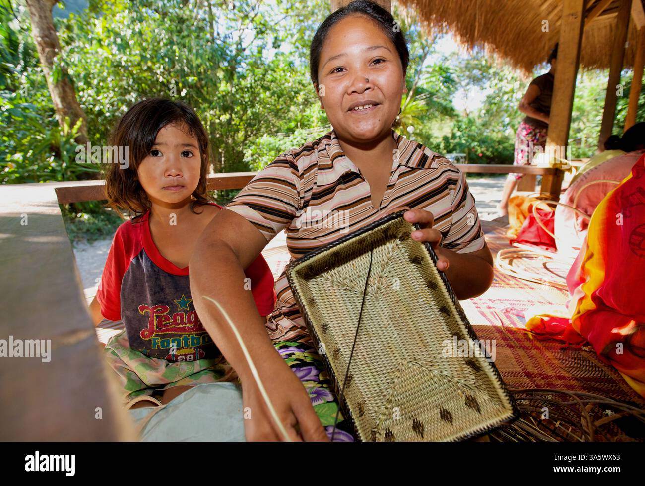 Members of the Iriya tribe, Mindoro’s indigenous people, weave baskets ...