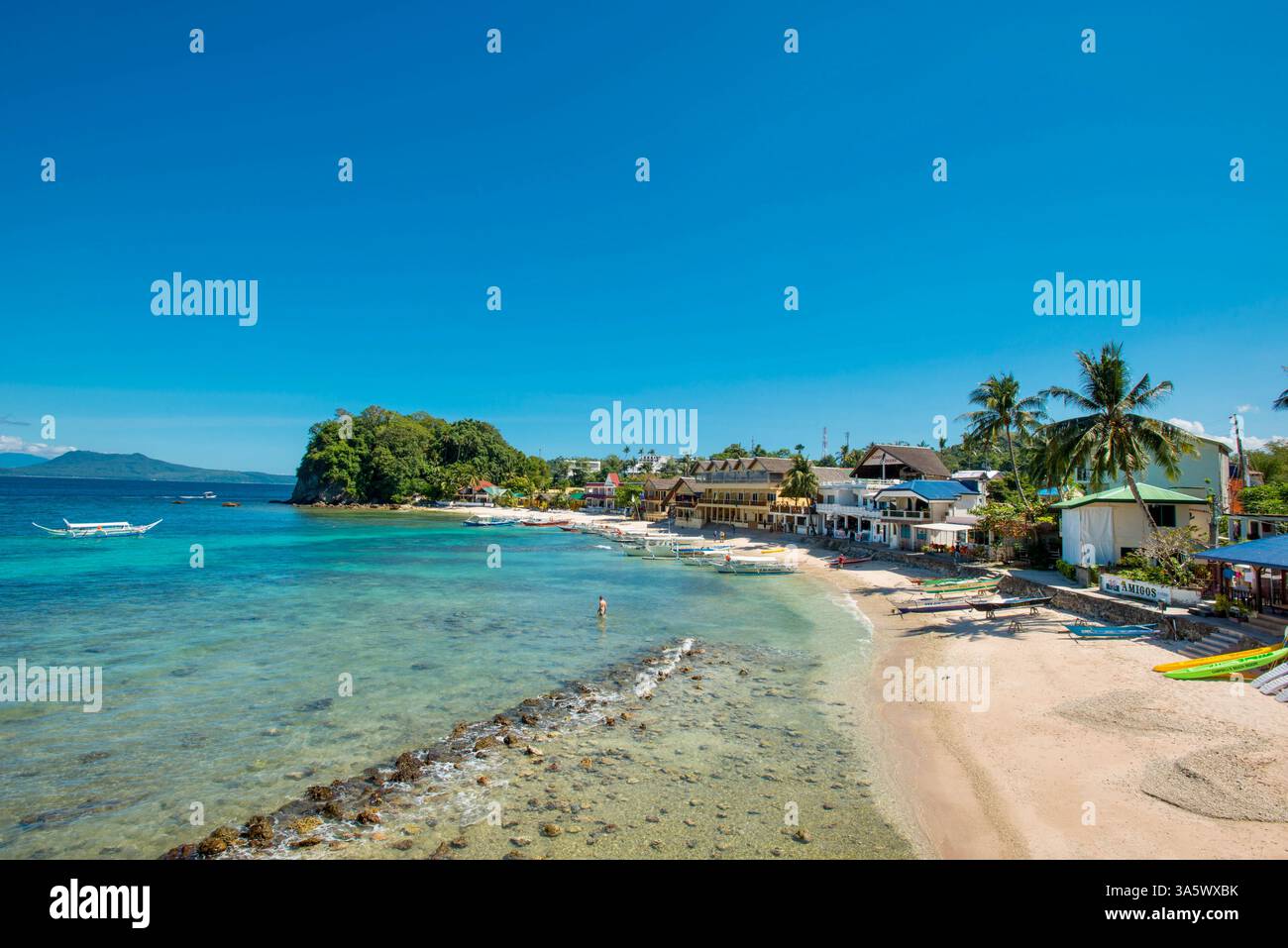 Photo shows the pretty cove at Big La Laguna, Puerto Galera on Mindoro ...