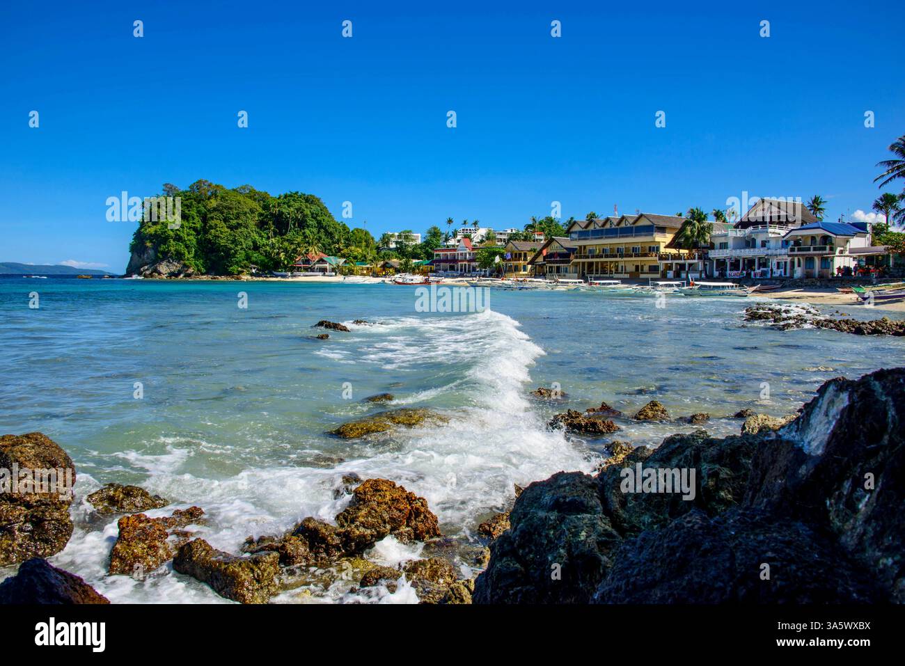 Photo shows the pretty cove at Big La Laguna, Puerto Galera, on Mindoro ...
