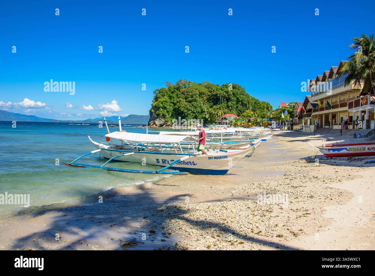 Photo shows the pretty cove at Big La Laguna, Puerto Galera, the ...