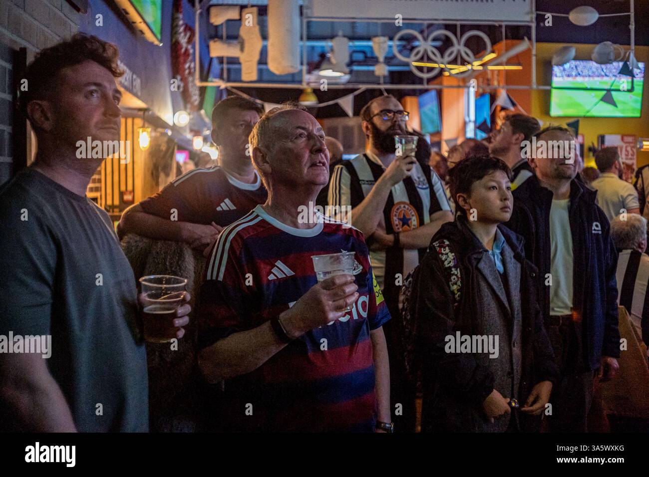 At a Marylebone sports bar, Newcastle United fans anxiously watch the ...