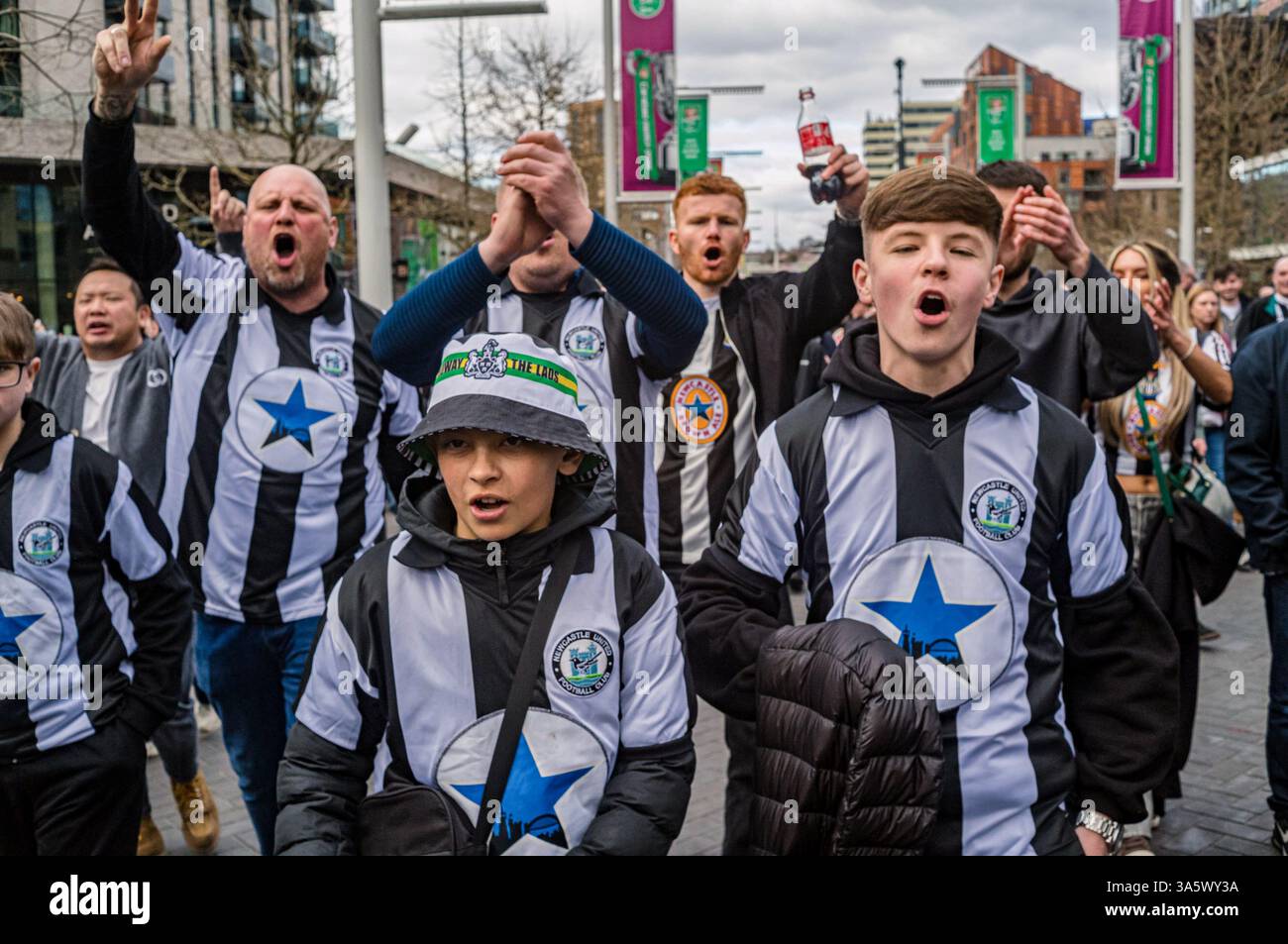 Newcastle United fans clap and chant as they walk towards the stadium ...