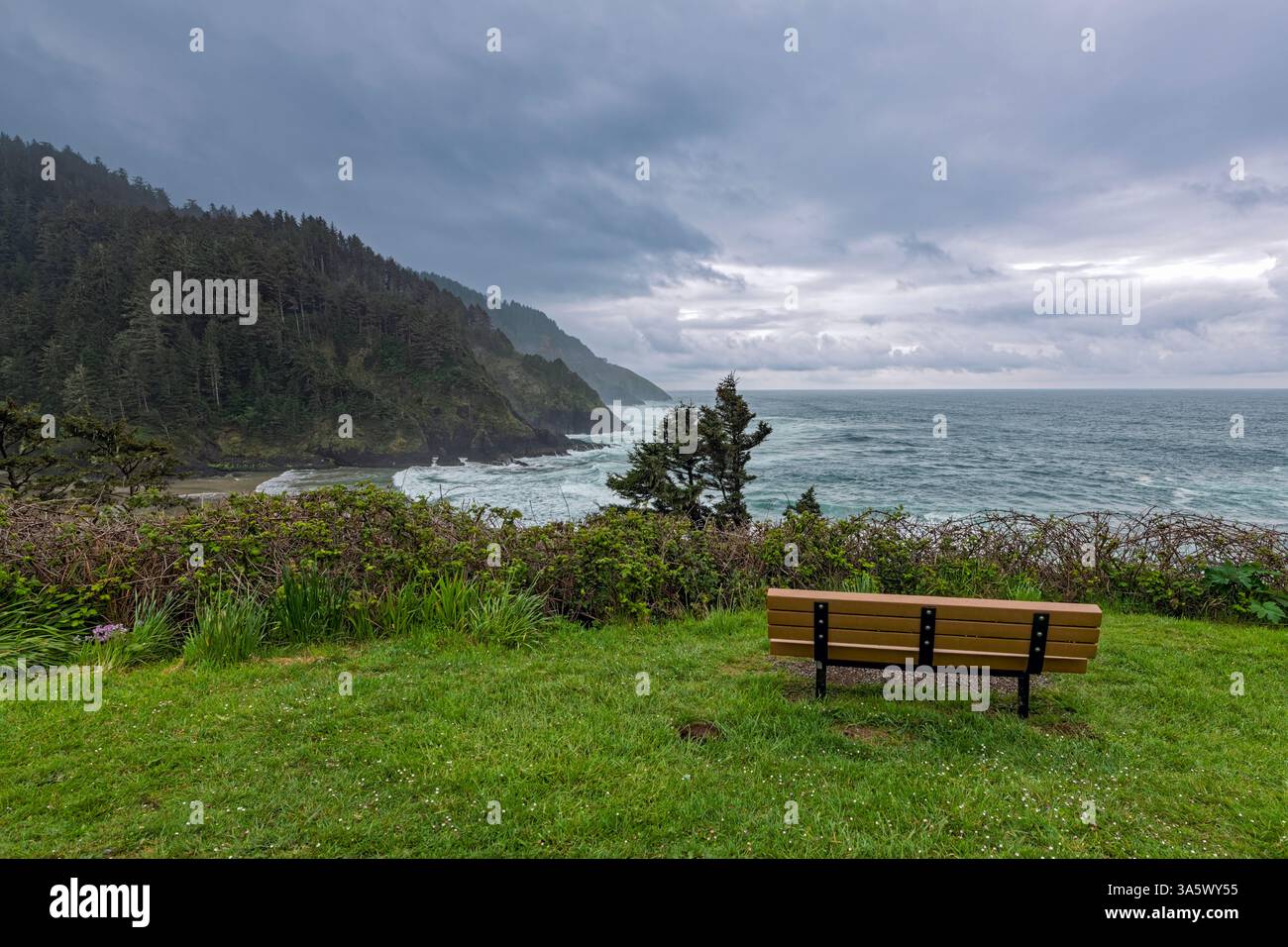 A bench overlooks Cape Cove Beach in Devil's Elbow State Park at the ...