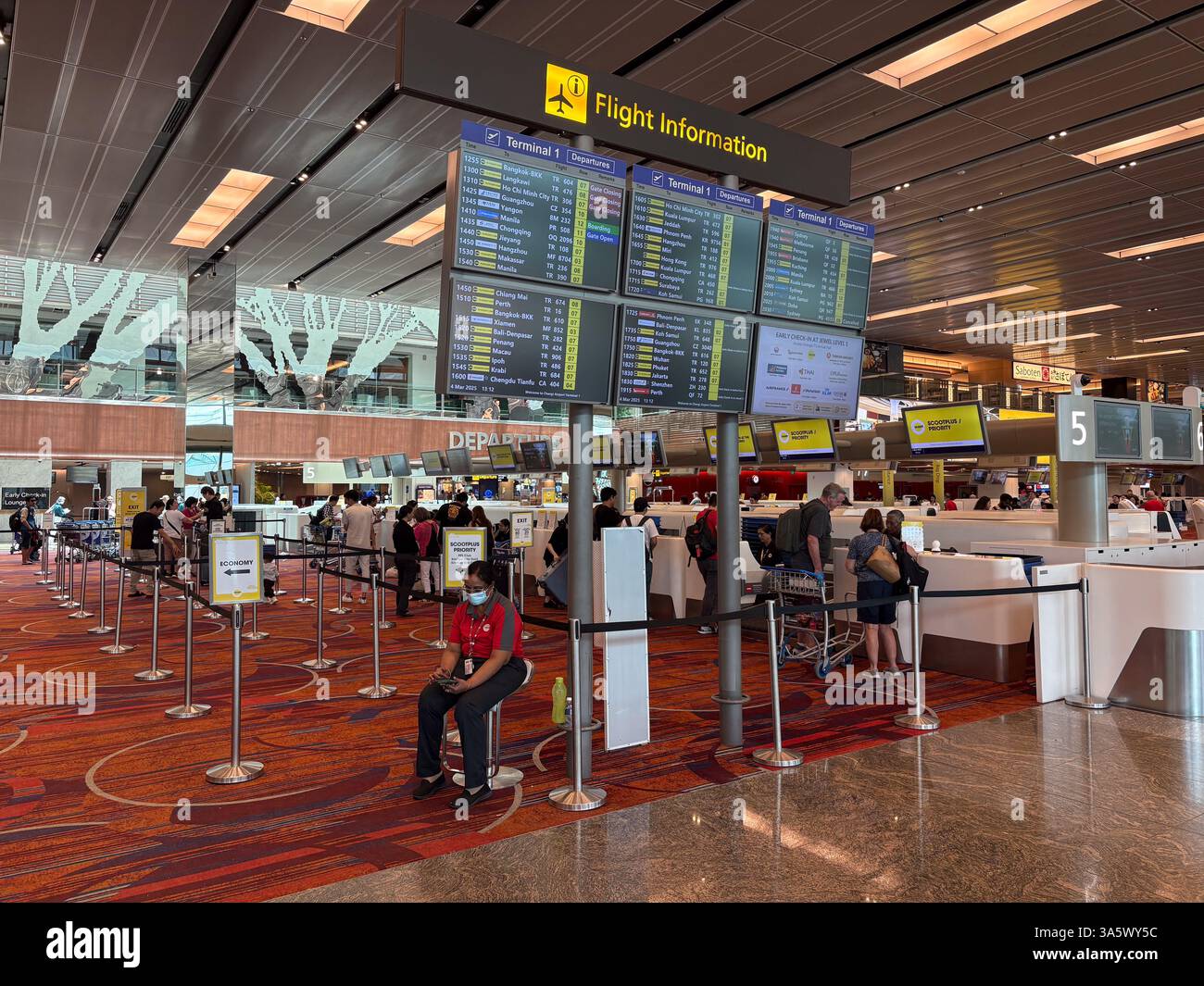 Singapore Changi Airport Terminal 1 departure hall with flight ...