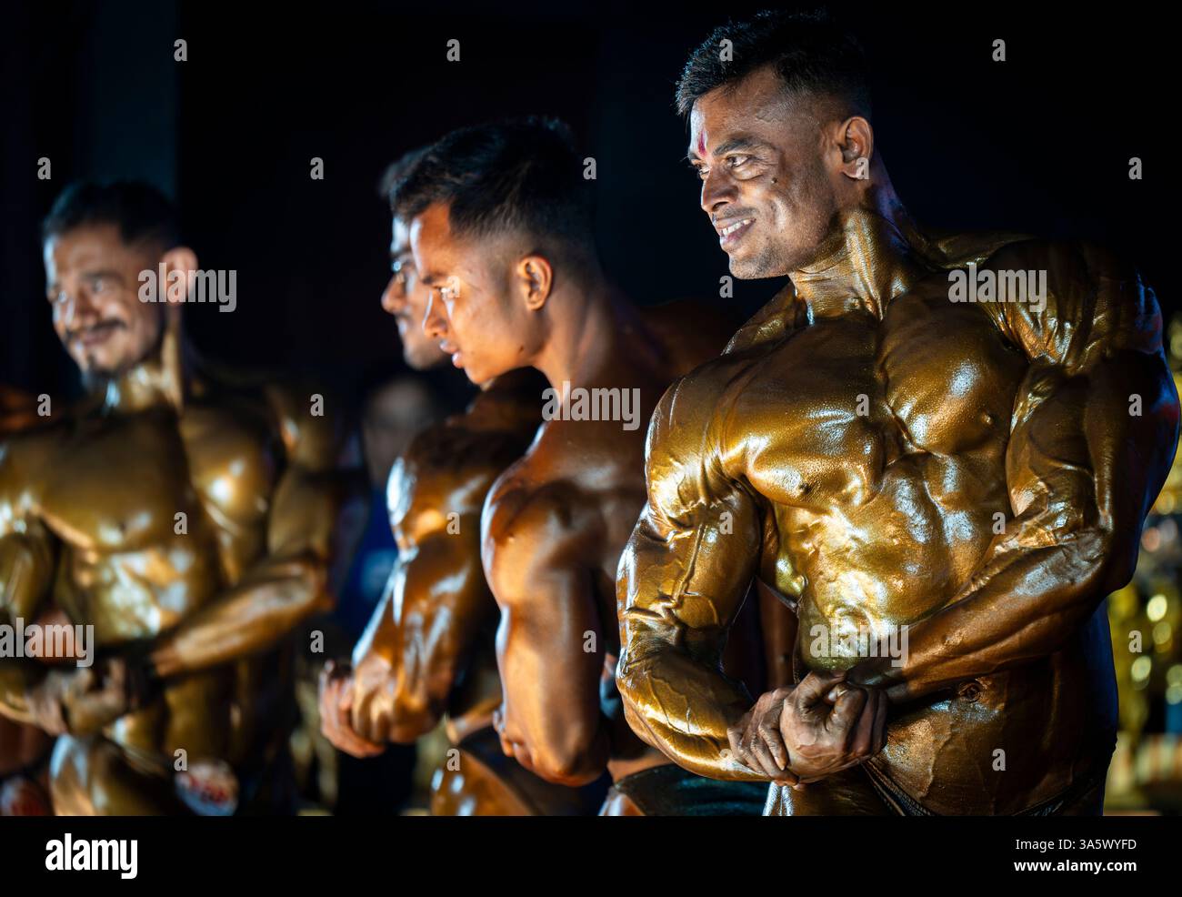 March 23, 2025: Male bodybuilding competitors flex their muscles as ...