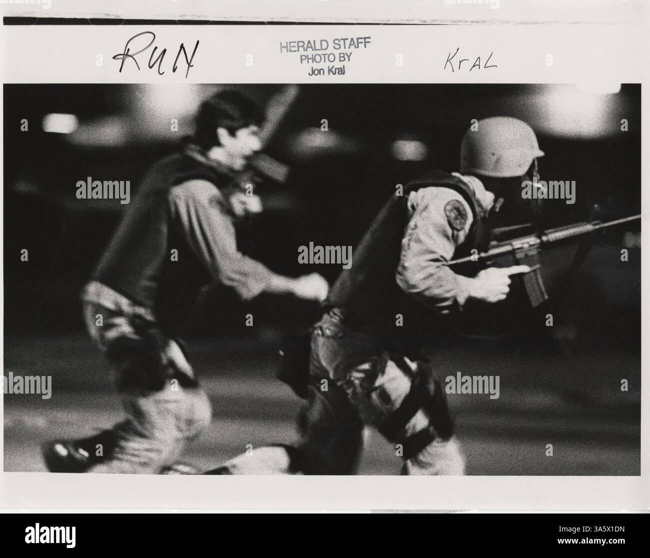 Jan. 17, 1989 - Miami, FL, USA - Police in riot gear rust to the ...