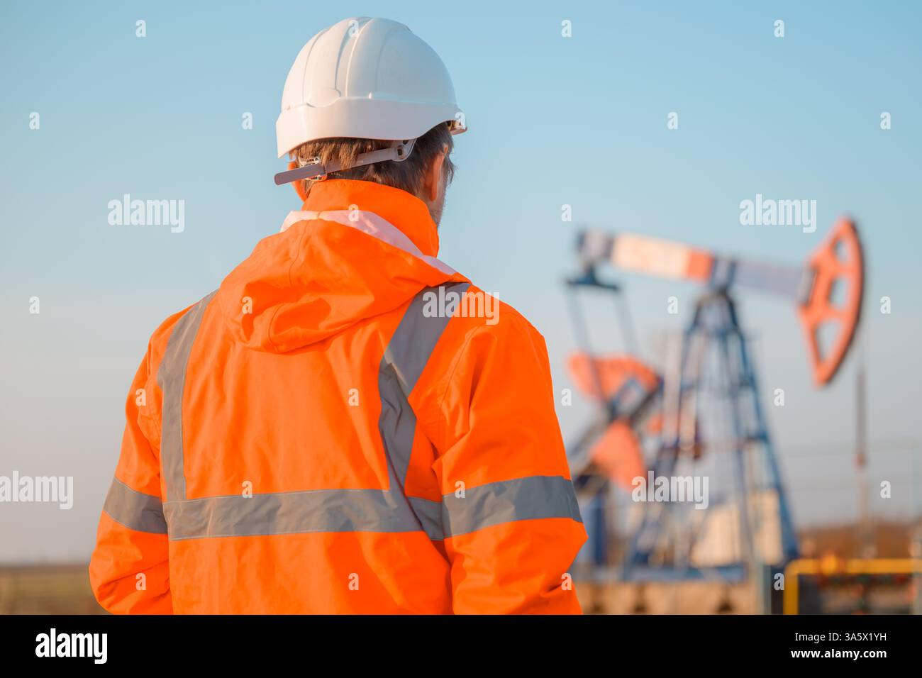Drilling rig engineer supervising the process of oil and gas extraction ...