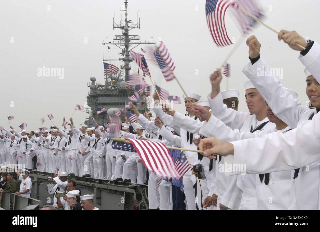 Jun 02, 2003; San Diego, CA, USA; Sailors crowd the deck as the ...