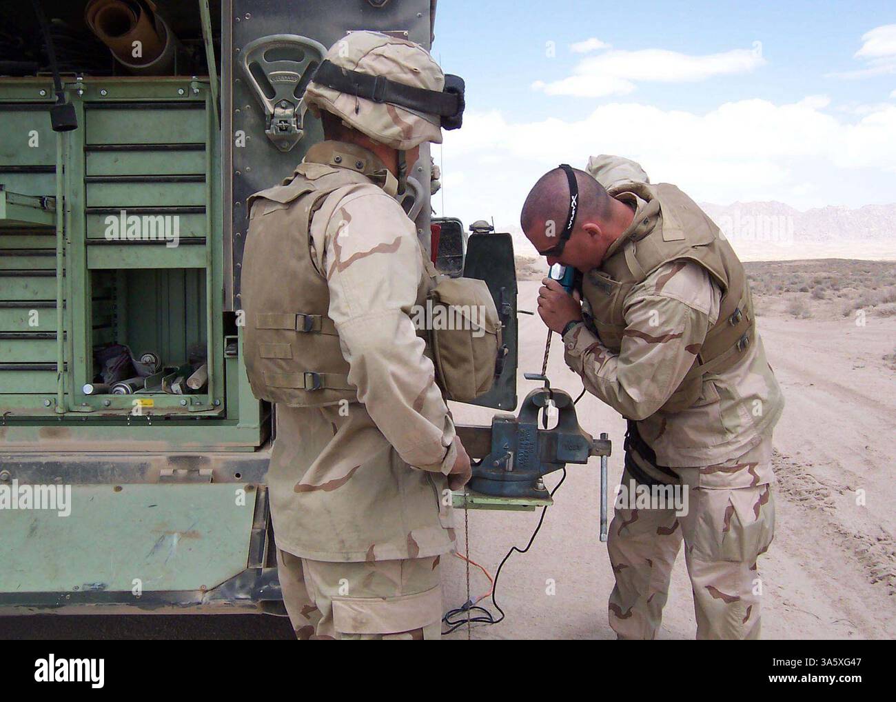 Apr 13, 2004; FOB Ripley, Afghanistan; Cpl. JUSTIN LOPER watches as ...