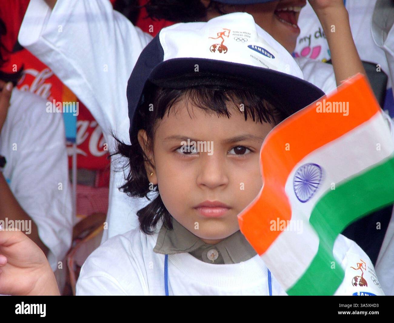 Jun 10, 2004; New Delhi, INDIA; A small child waves a flag to welcome ...