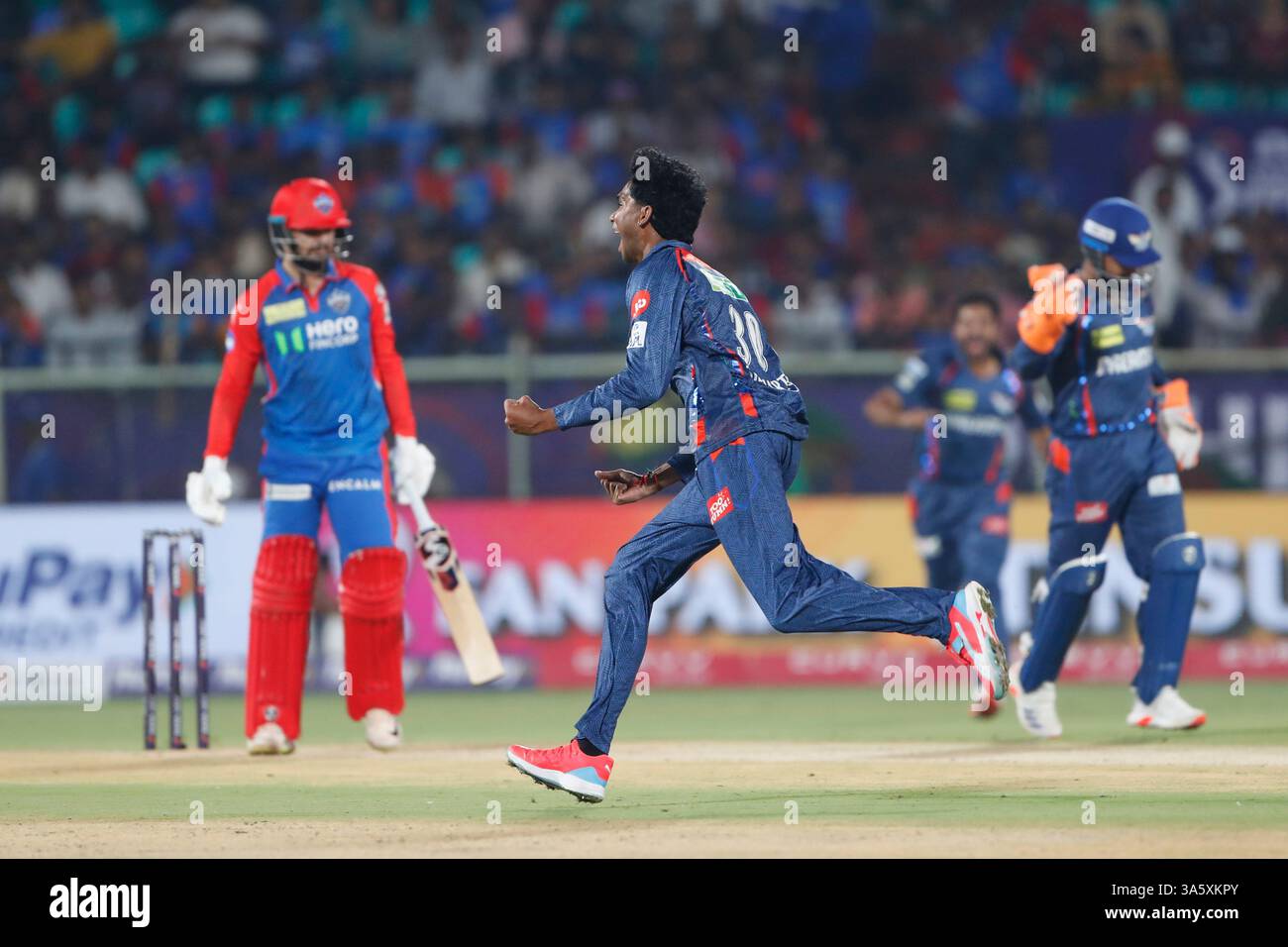 Lucknow Super Giants' Manimaran Siddharth, right, celebrates the ...