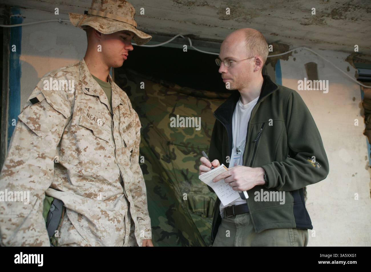 Nov 07, 2004; Camp Fallujah, Iraq; An embedded reporter takes time to ...