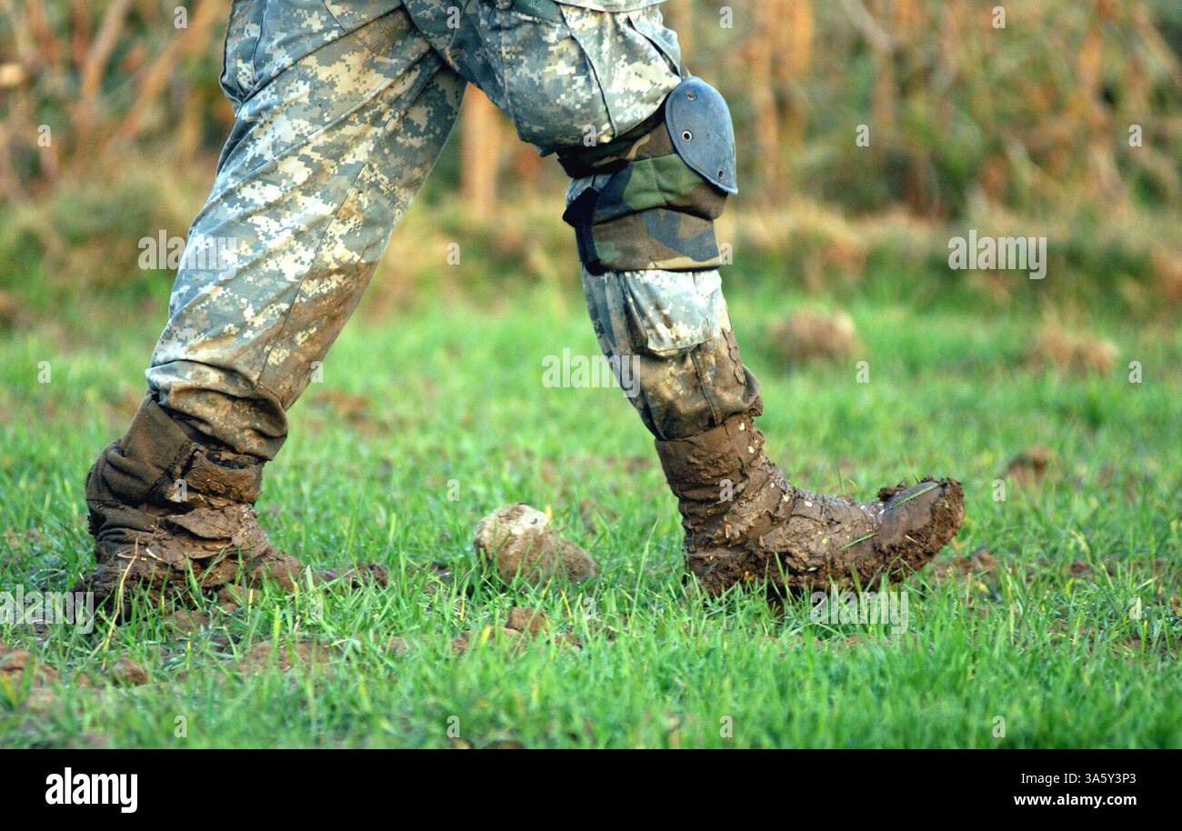 Nov 21, 2005; Bayji, IRAQ; Muddy boots from searching farm fields on an ...