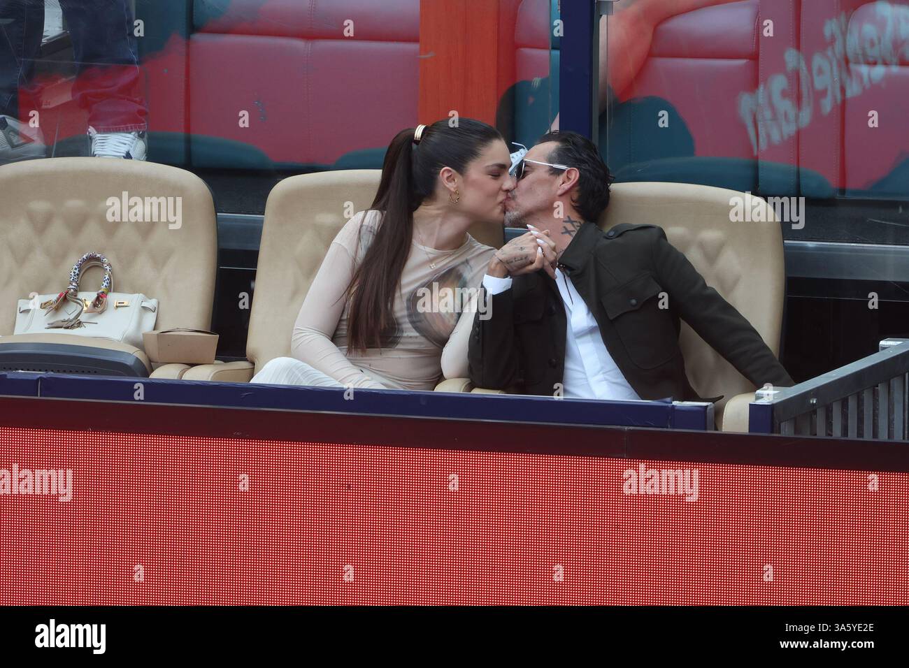 MIAMI GARDENS, FLORIDA - MARCH 23: Marc Anthony and his wife Nadia Ferreira attend the match ...