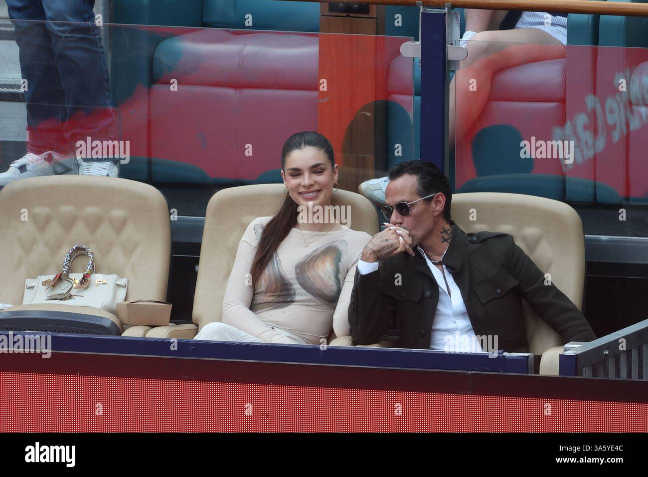 MIAMI GARDENS, FLORIDA - MARCH 23: Marc Anthony and his wife Nadia Ferreira attend the match ...