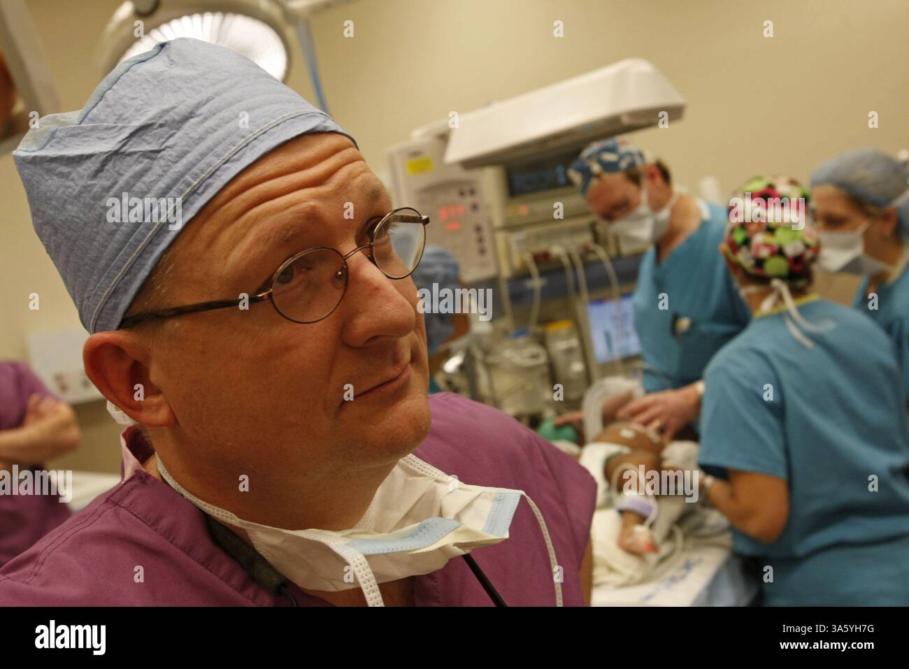March 18, 2008 - Dr. Benjamin Warf is seen in the operating room after ...