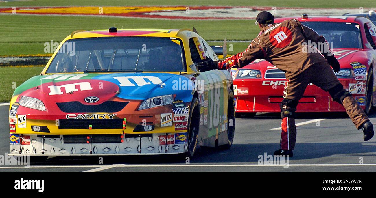 May 26, 2008 - A crew member slaps hands with driver Kyle Busch as he ...