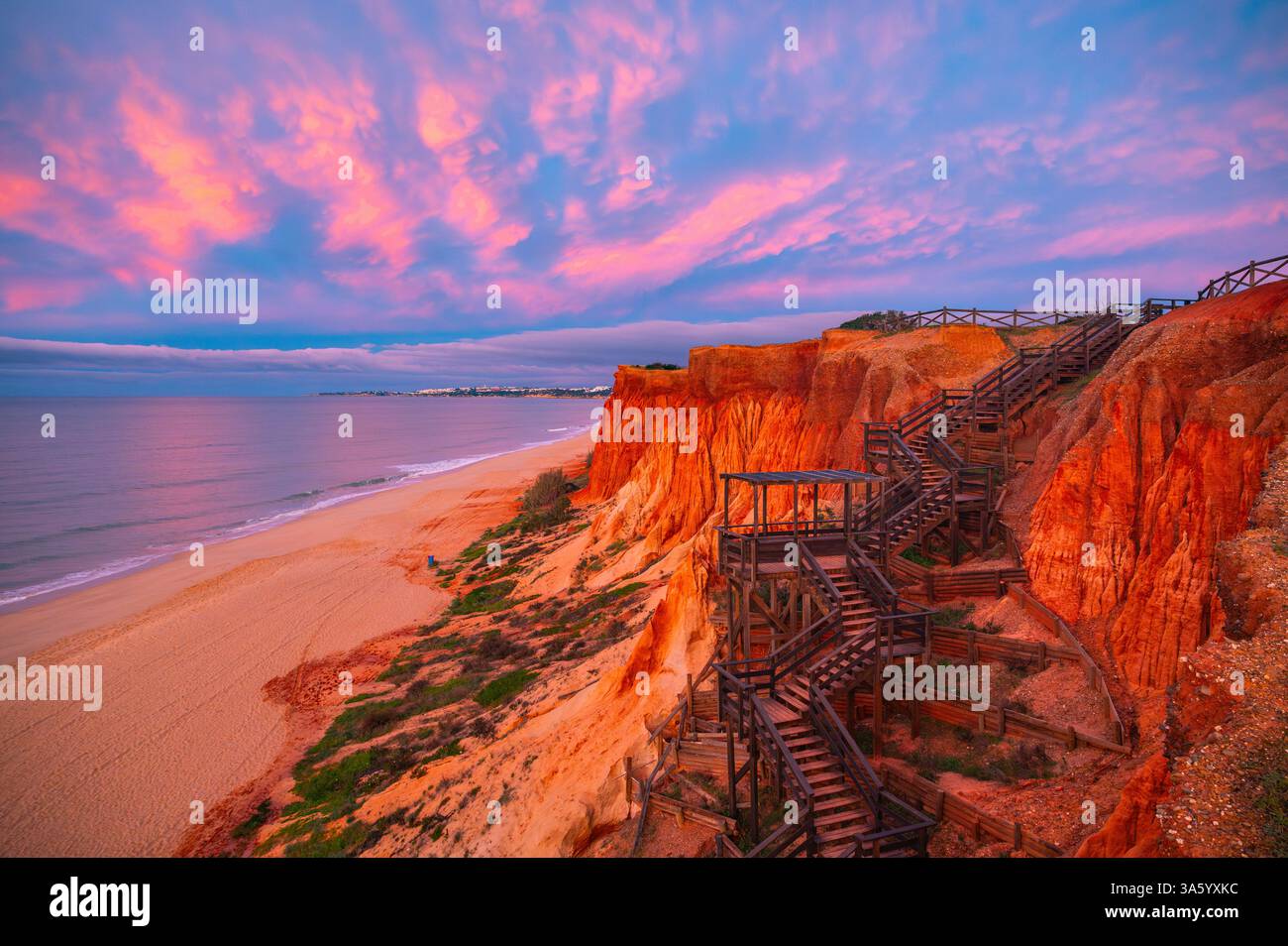 Dramatic Purple sky and orange sunrise light at Falesia Beach ...